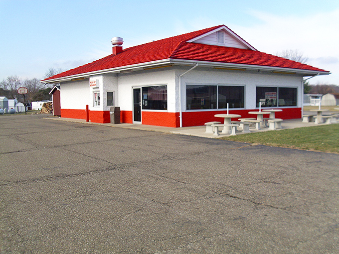 The iconic red-roofed building stands like a barbecue beacon in Nashport, promising smoky delights within its unassuming walls.