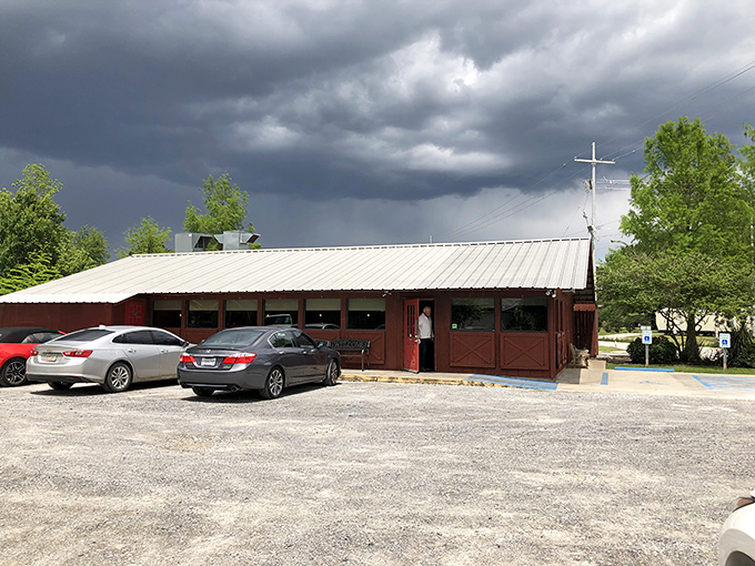 Even under stormy Louisiana skies, Bon Temps Grill's rustic barn-like exterior promises warm Cajun comfort and those heavenly crab cakes within.