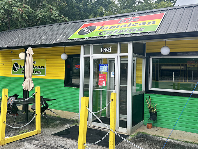 The vibrant yellow and green exterior of R&N Irie Jamaican Cuisine stands out like a tropical bird that flew north and decided to nest in Chattanooga.