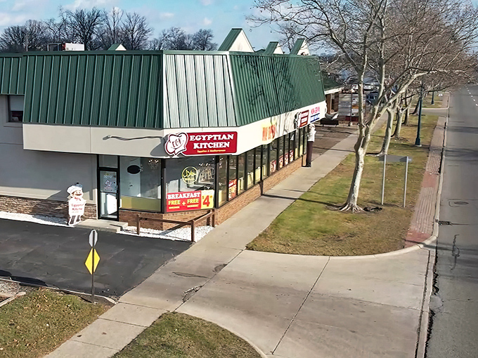 That bright yellow stripe isn't just decoration &ndash; it's like a beacon guiding hungry souls to authentic Egyptian culinary treasures.
