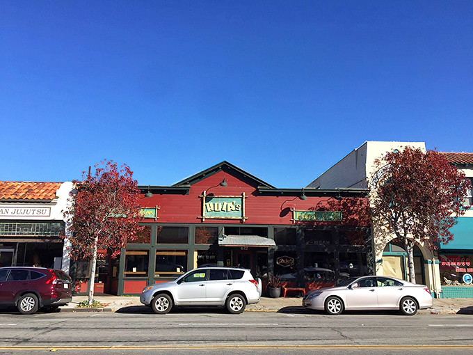The bright red exterior of Hula's Island Grill stands out on Lighthouse Avenue like a tropical oasis in Monterey's coastal landscape.