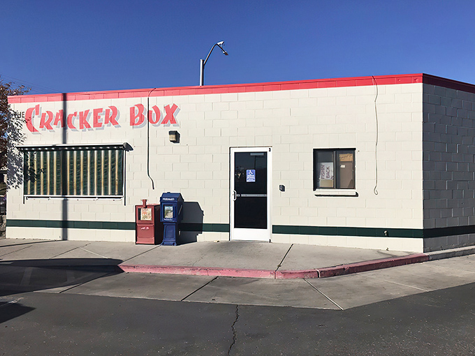 The unassuming exterior of The Cracker Box stands like a culinary sentinel on the corner, its red-trimmed sign promising breakfast treasures within.