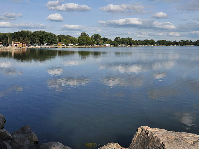 Black Hawk Lake mirrors the sky like nature's own Instagram filter. The perfect stillness makes you wonder if time itself takes vacation days here.