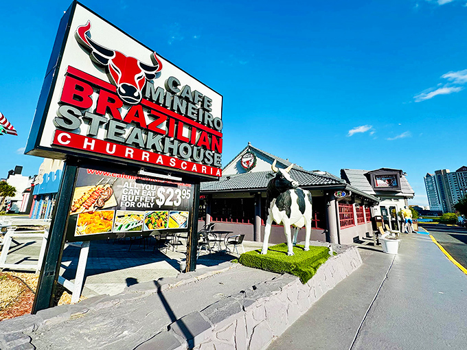 The iconic red bull logo welcomes hungry visitors to Cafe Mineiro, where that life-sized cow statue isn't just decoration&mdash;it's foreshadowing for the meat feast awaiting inside.