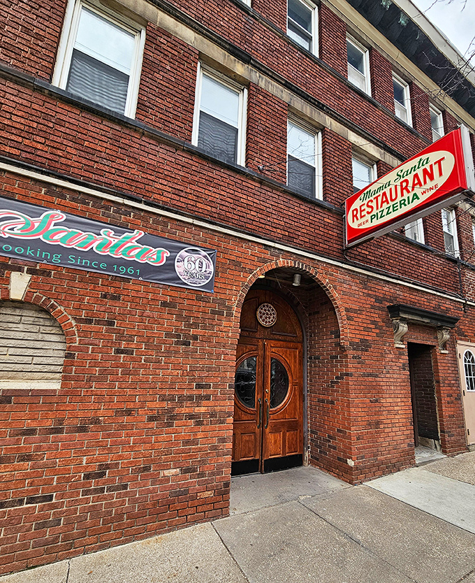 The brick facade of Mama Santa's stands like a time capsule on Mayfield Road, its vintage sign promising Italian comfort that Cleveland has embraced for generations.
