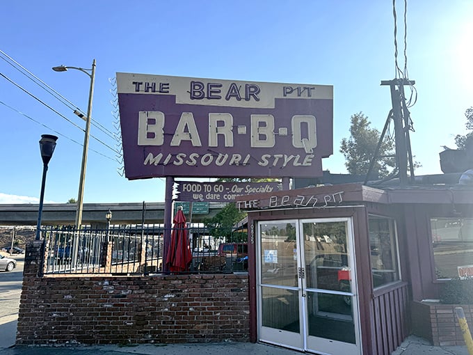 The same sign, different angle, same promise of smoky delights. Like a BBQ lighthouse guiding you home through the suburban seas.