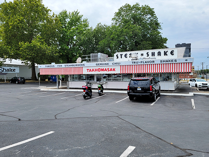 The red and white awnings aren't just decorative&mdash;they're beacons of hope for hungry travelers seeking salvation in steakburger form.