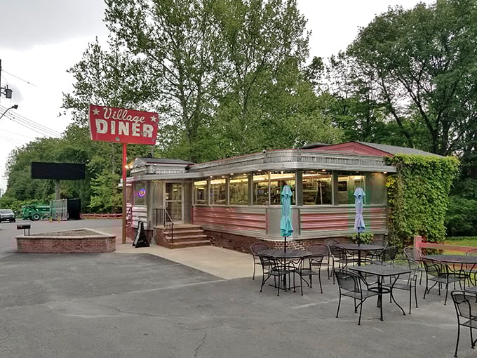 The Village Diner's classic stainless steel exterior gleams like a time machine to when calories were just happy little numbers.