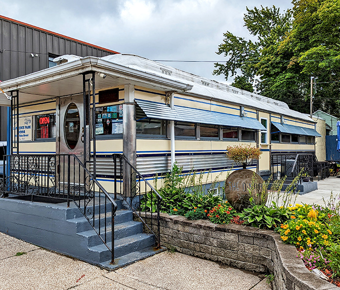 The gleaming silver exterior of Lawrence Park Dinor catches the morning light, a vintage railroad car transformed into a temple of breakfast delights.