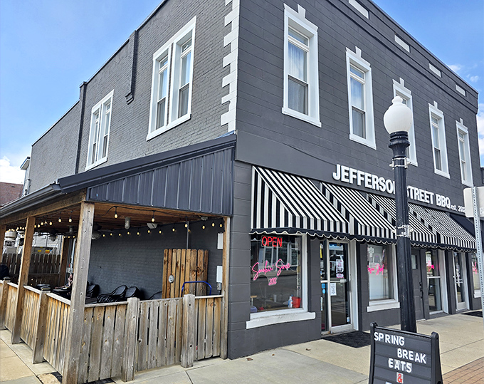 The unassuming brick facade of Jefferson Street BBQ in Converse hides culinary treasures within. Those classic striped awnings practically whisper, "Come in, the brisket's waiting."