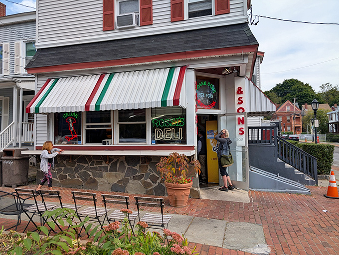 That striped awning beckons like a carnival tent, but instead of clowns, you'll find sandwich wizards inside.