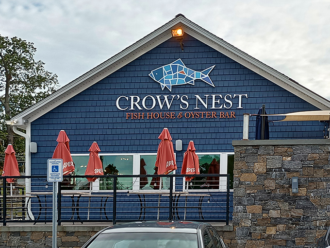 The blue clapboard exterior of Crow's Nest stands like a maritime beacon for hungry souls, promising seafood treasures within its welcoming walls.