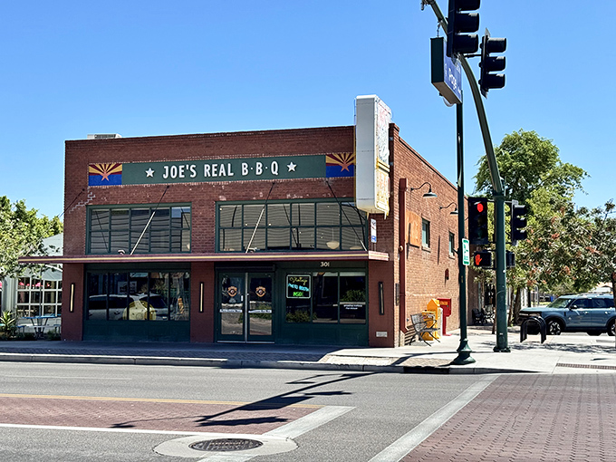 The brick facade of Joe's Real BBQ stands like a barbecue beacon in downtown Gilbert, promising smoky treasures within those hallowed walls.