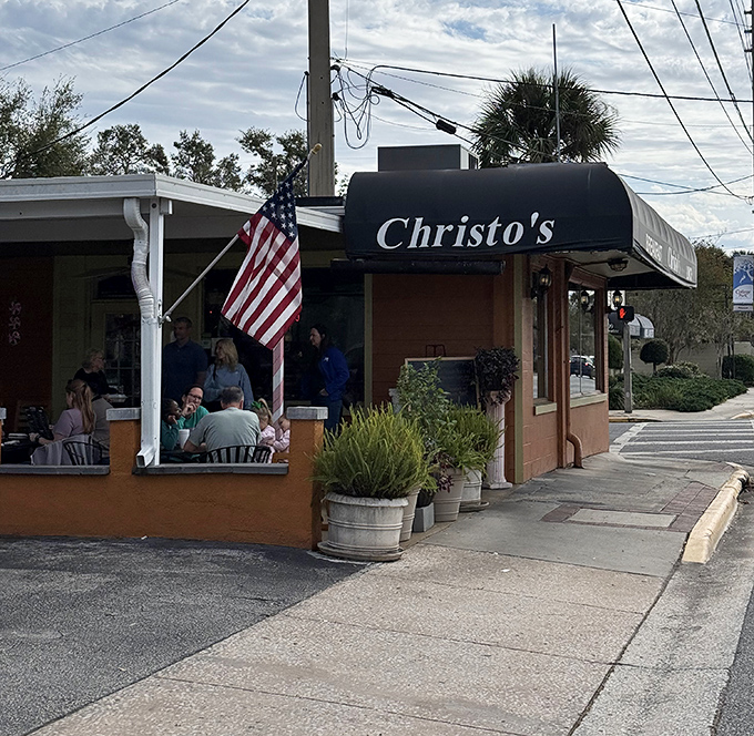 The American flag waves a patriotic hello outside Christo's Caf&eacute;, where locals gather on the patio to start their day with sunshine and satisfaction.