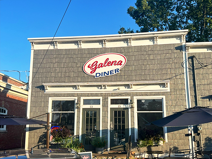 The stone facade of Galena Diner stands proudly against a blue Ohio sky, its classic red sign promising comfort food treasures within.