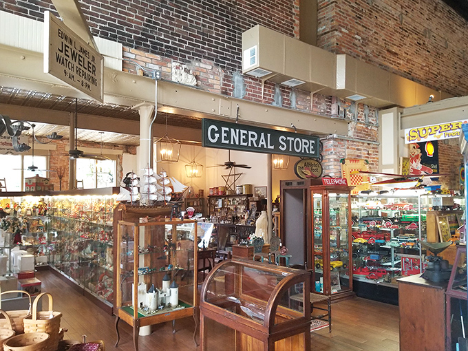 Glass display cases line wooden floors at Toy Town Antiques, where childhood memories wait behind every pristine cabinet door.