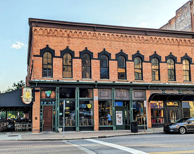 The historic brick facade with emerald green trim promises authentic Irish charm before you even step inside. Toledo's downtown gem beckons with old-world character.