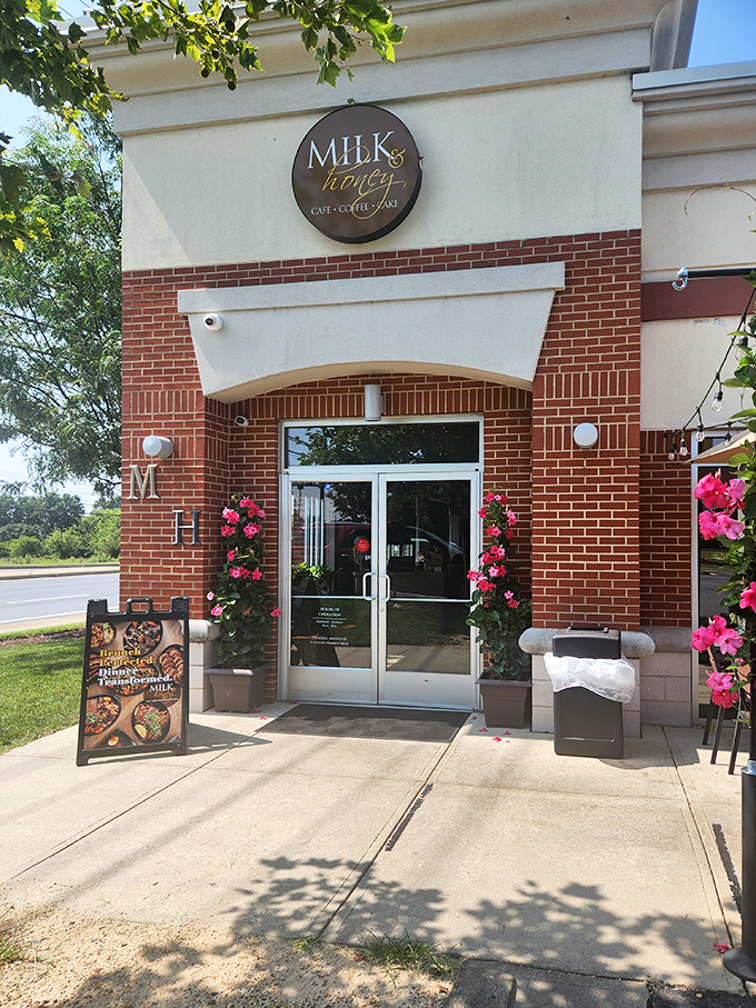 The brick-and-cream exterior of Milk & Honey stands like a beacon of brunch hope in College Park, promising Southern comfort in every bite.