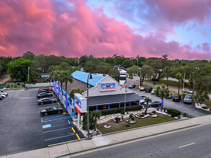 Sunset paints the sky cotton candy pink above Seafood World, as if Mother Nature herself is setting the mood for your seafood feast.