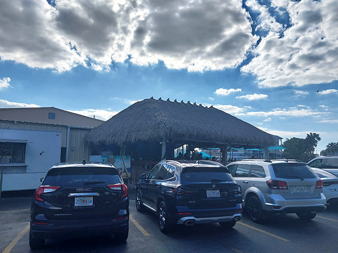 Parking lot view that says, "Your diet ends here." That thatched roof is the universal symbol for "good times ahead."