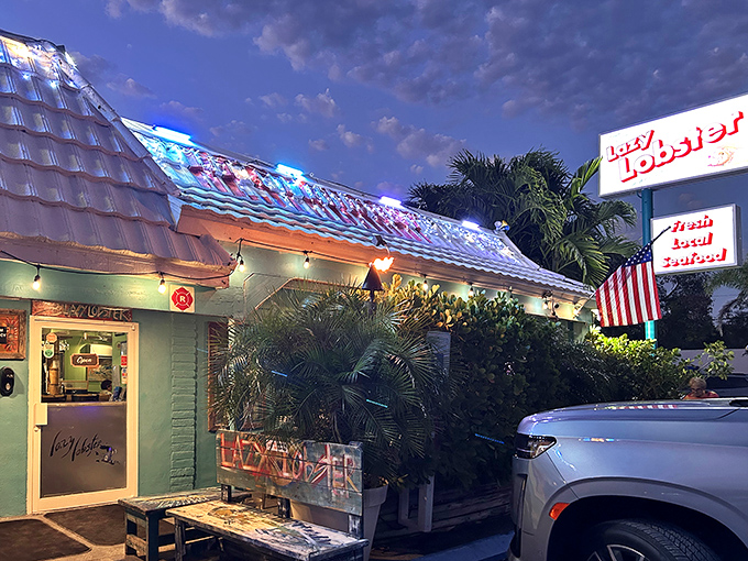 The mint-green exterior of Lazy Lobster glows at twilight, like a beacon calling all seafood lovers home to Key Largo's hidden treasure.