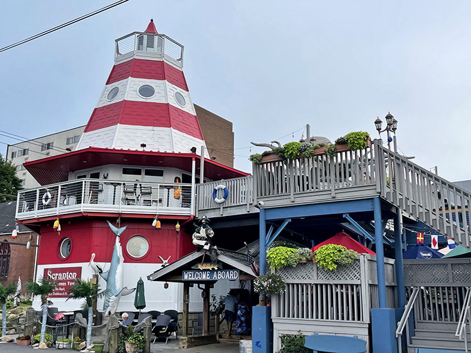 Cooper's iconic lighthouse exterior stands like a nautical mirage in landlocked Scranton, complete with porthole windows and maritime charm.