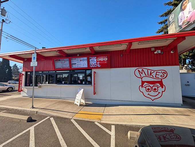 The iconic red and white exterior of Mike's Drive-In stands as a beacon of burger bliss in Milwaukie, where nostalgia meets satisfaction.