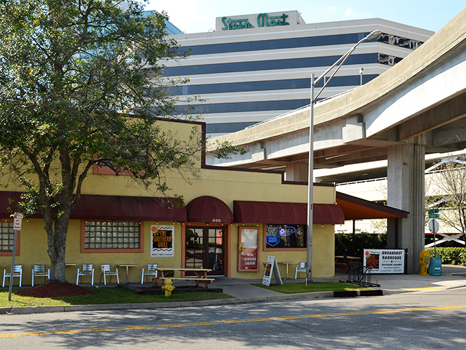 Nestled near Jacksonville's bustling cityscape, this yellow-walled barbecue haven stands like a delicious time capsule from simpler, more flavorful days.
