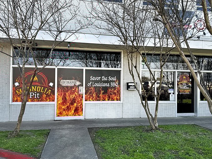 The unassuming storefront might fool you, but those flame decals aren't lying&mdash;serious barbecue magic happens behind these doors.