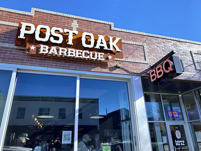The rusted metal sign against brick says everything you need to know: authentic Texas-style BBQ has planted its flag in Denver's Berkeley neighborhood.