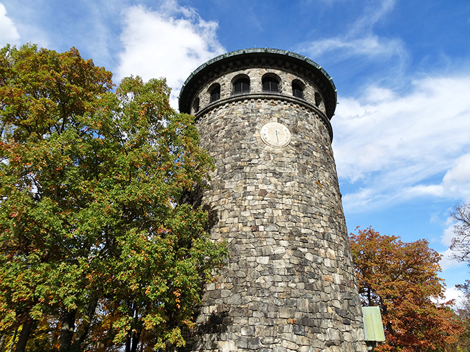 Standing tall since the late 19th century, Rockford Tower's stone silhouette against the autumn sky looks like it was plucked straight from a European countryside.