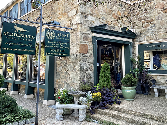 A stone building that's seen more stories than a library, with hanging signs that promise treasures for those willing to hunt.
