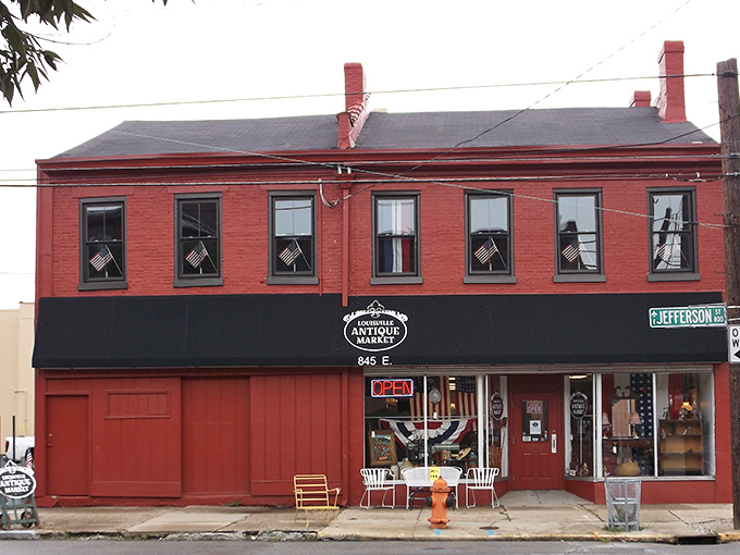 The brick-red fa&ccedil;ade of Louisville Antique Market stands like a time portal on Jefferson Street, American flags hinting at the historical treasures within.