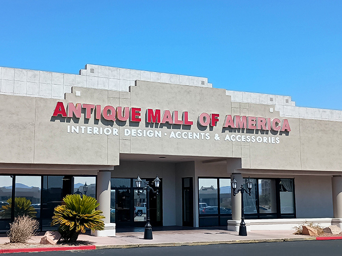 The desert sun highlights the bold red signage of Antique Mall of America, standing like a time capsule against the Nevada sky.