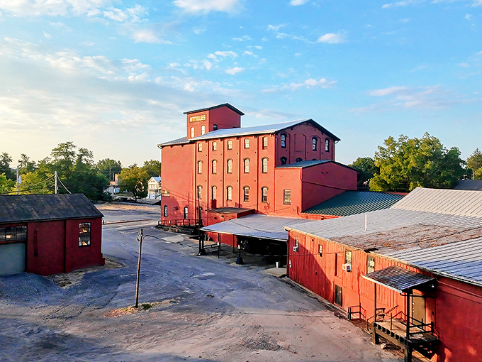 The iconic red brick exterior of Roller Mills stands like a Victorian sentinel, promising treasures within its historic walls.