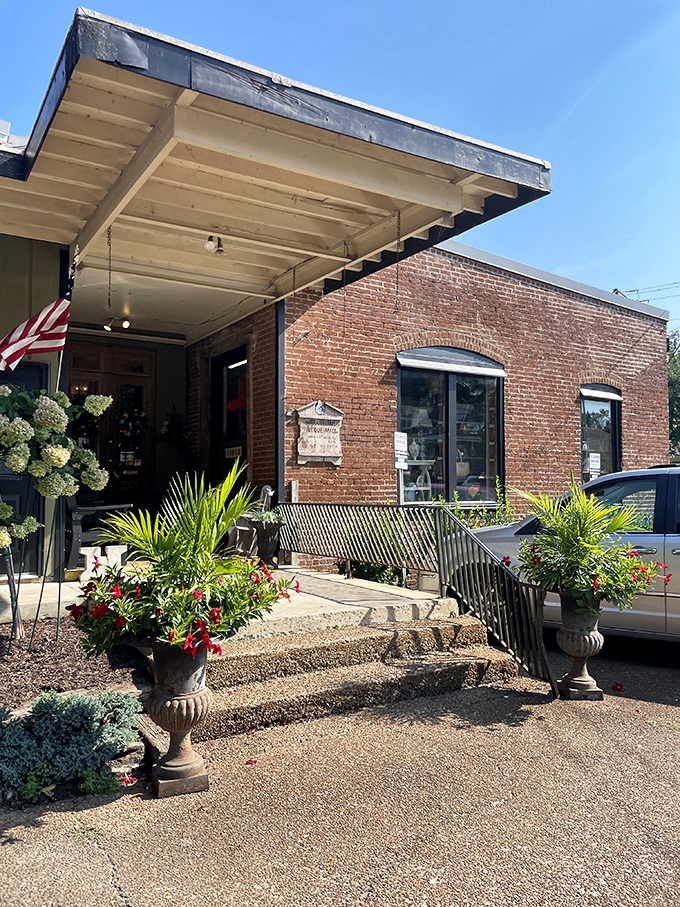 Brick, blooms, and a bit of Southern charm &ndash; this entrance has been welcoming treasure hunters since 1972, proving good taste never goes out of style.