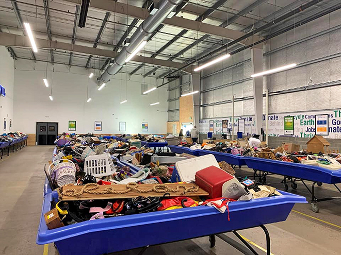Welcome to treasure hunter paradise! The iconic blue bins of Goodwill's As-Is Outlet stretch across the warehouse floor like an archaeological dig site for modern bargain hunters.