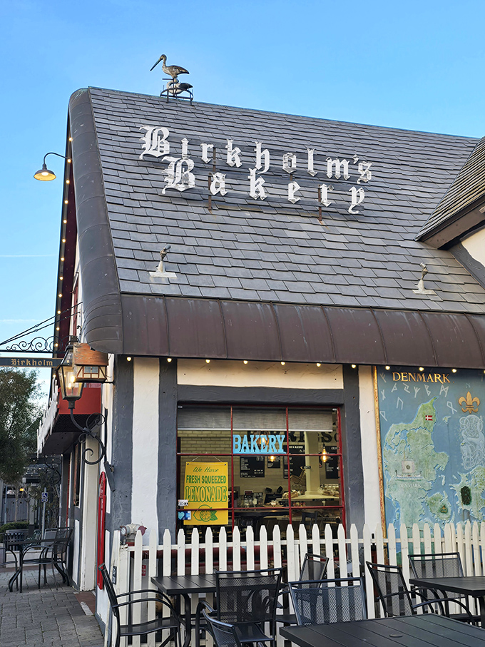 The storybook charm of Birkholm's exterior feels like you've stumbled into a Danish fairy tale, complete with a whimsical bird weathervane keeping watch over pastry paradise.