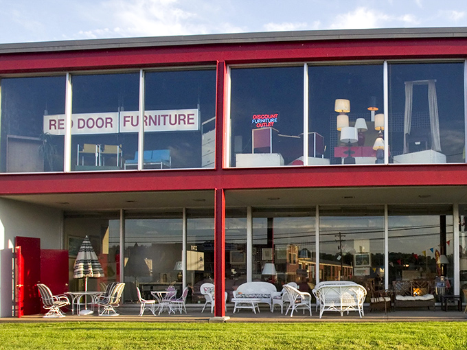 The iconic red-trimmed building stands out like a fashionable lady in a sea of beige, beckoning treasure hunters with promises of undiscovered gems inside.