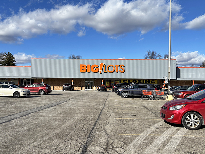 The iconic orange sign beckons like a lighthouse for bargain hunters. Under blue Ohio skies, adventure awaits behind those sliding doors.