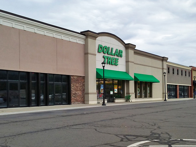 That familiar green and white storefront promises affordable adventures waiting just beyond those automatic doors.