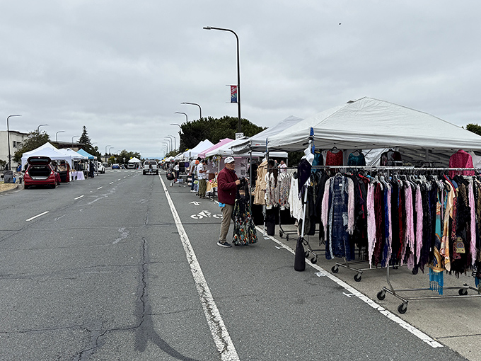The weekend transformation begins: rows of white tents line the Ashby BART parking lot, turning ordinary asphalt into a treasure hunter's paradise.