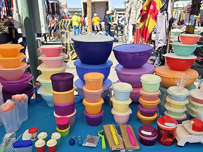 A rainbow of plastic containers stacked like a Tupperware fever dream &ndash; storage solutions that somehow make organization look like modern art.