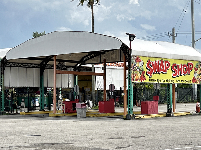 The iconic entrance to Fort Lauderdale's Swap Shop beckons with colorful signage and the promise of treasures waiting just beyond those white canopies.