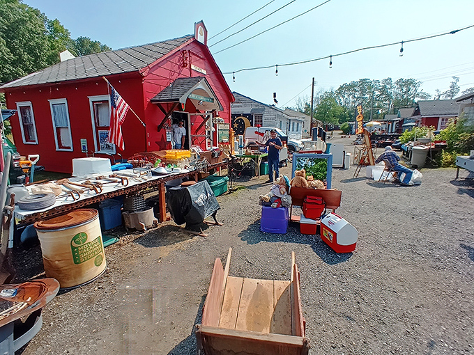 The iconic red schoolhouse building anchors the village of treasures, where bargain hunters gather like pilgrims at a shrine.