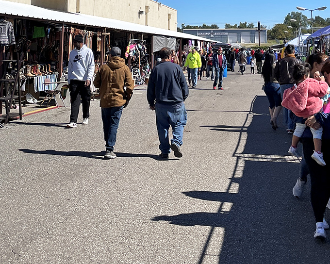 Weekend warriors navigate the bustling outdoor section, where boots, clothing, and unexpected treasures line the pathways. The thrill of the hunt is real!