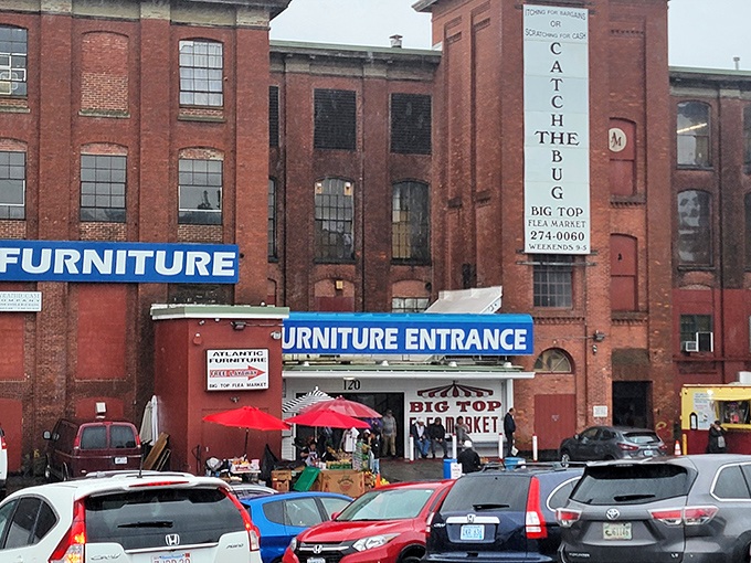 The historic brick facade of Big Top Flea Market stands as a monument to treasure hunting, where Providence's past meets its present in a carnival of commerce.