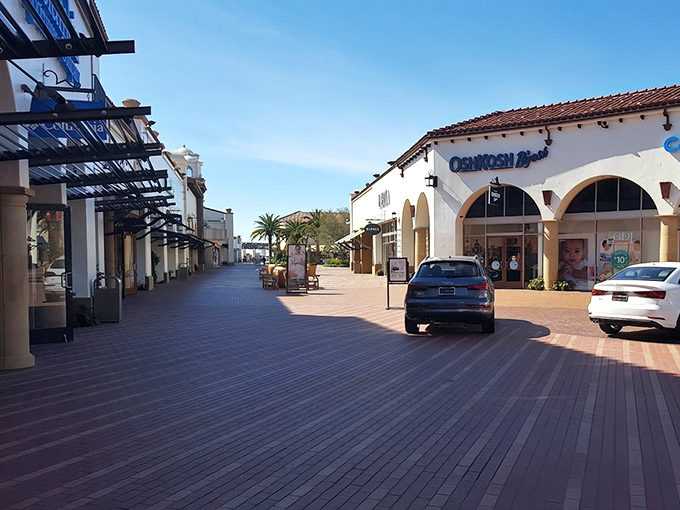 Palm trees and Spanish-style architecture create a shopping paradise that feels more like a Mediterranean resort than a bargain hunter's playground.