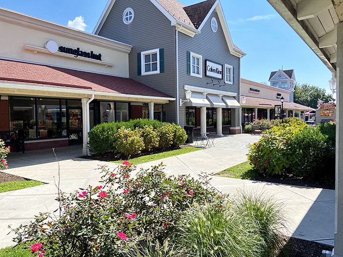 Sunlight bathes the storefronts as shoppers navigate between Timberland and Calvin Klein&mdash;retail therapy with a side of vitamin D.