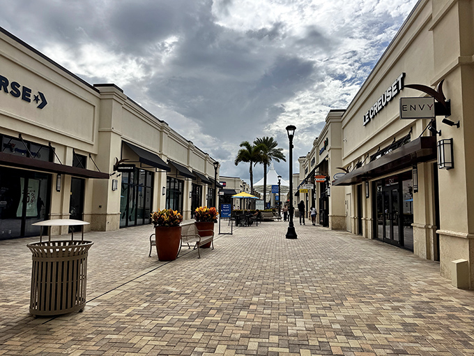 The pristine walkways of Tanger Outlets invite you to stroll in Florida sunshine, where shopping becomes an outdoor adventure rather than a fluorescent-lit obligation.